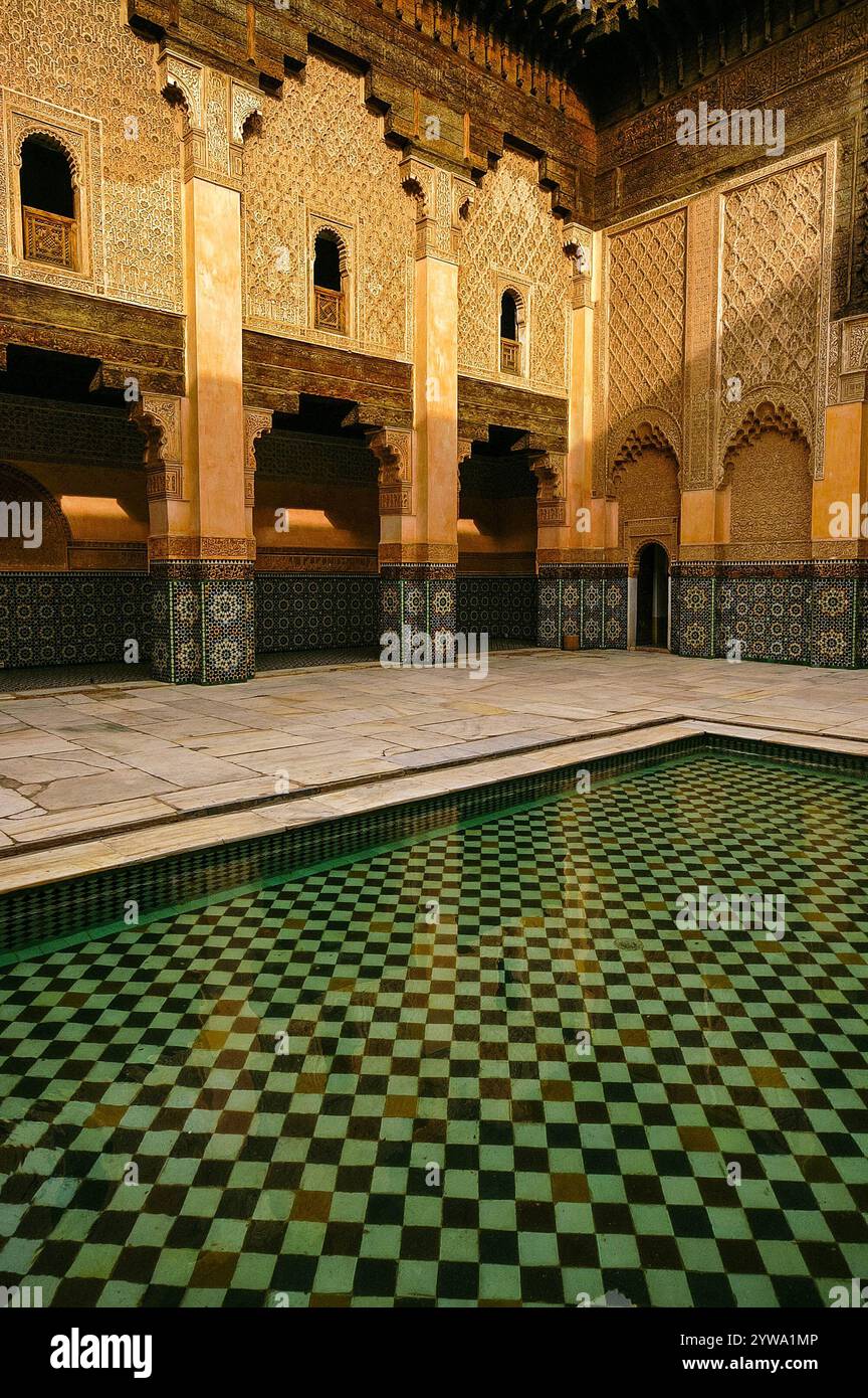 Central courtyard decorated with carved cedar wood.Madrasa Ben Youssef ...