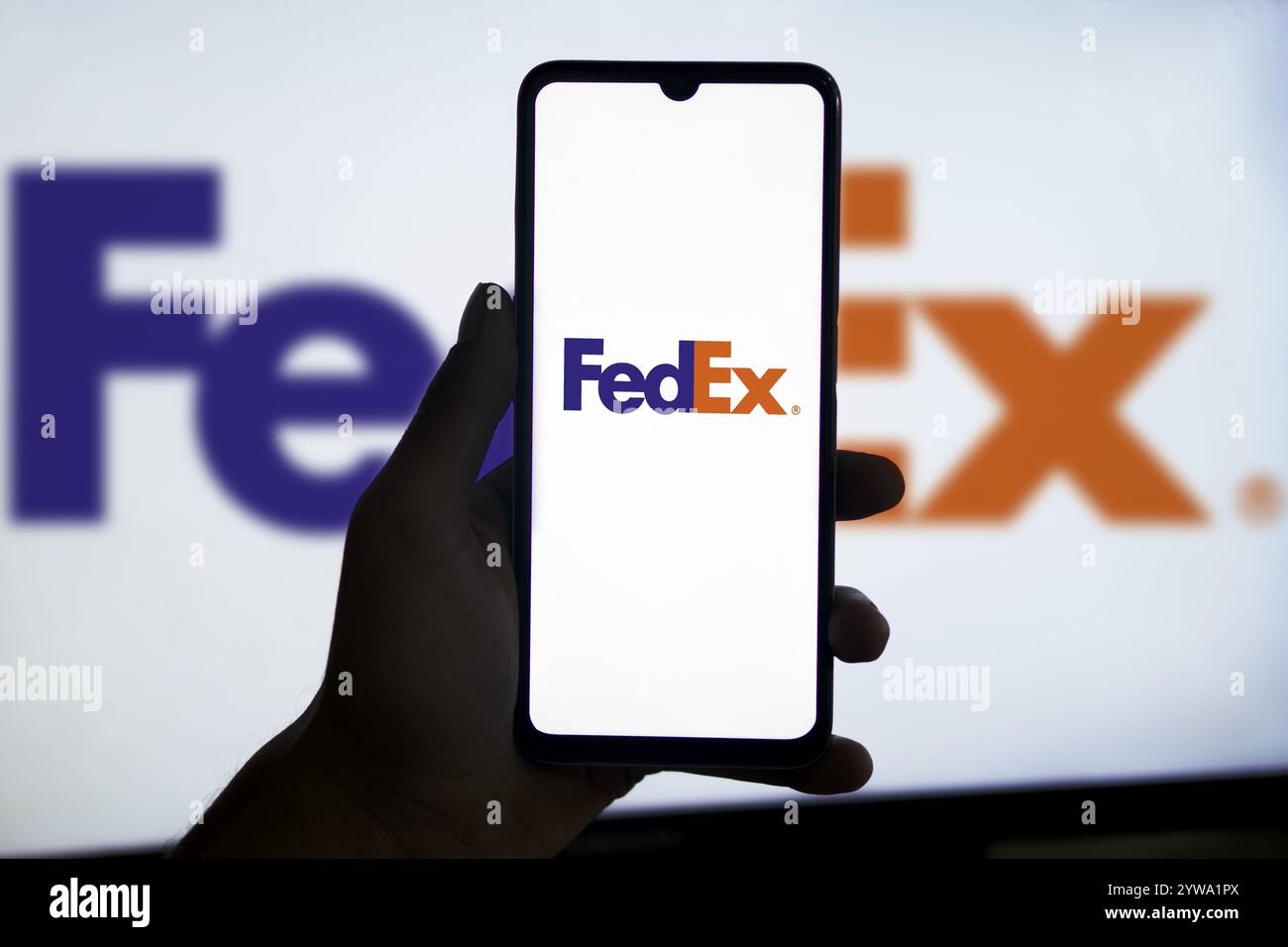 FedEx logo on smartphone Stock Photo - Alamy
