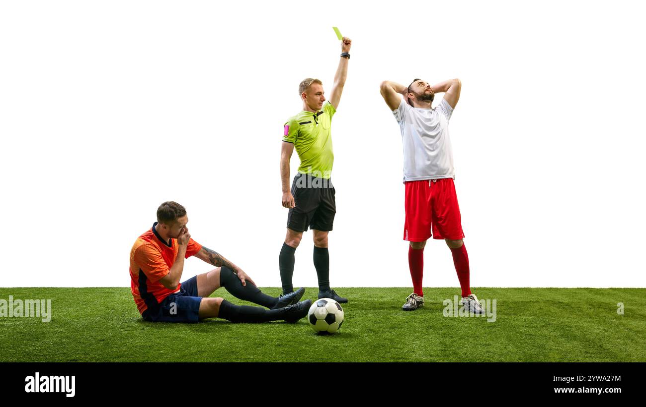 Referee showing yellow card to shocked man, while opponent player ...