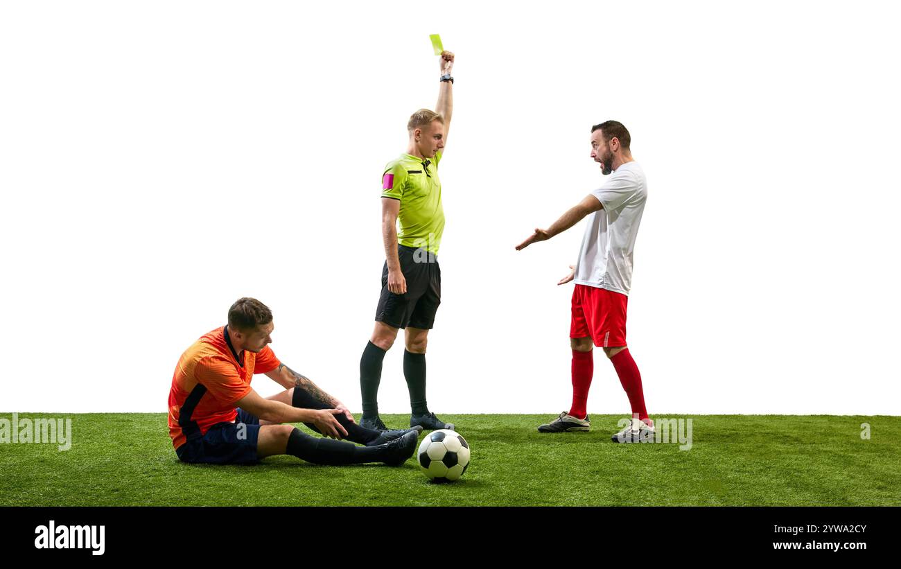 Referee showing yellow card to arguing man, while opponent player ...