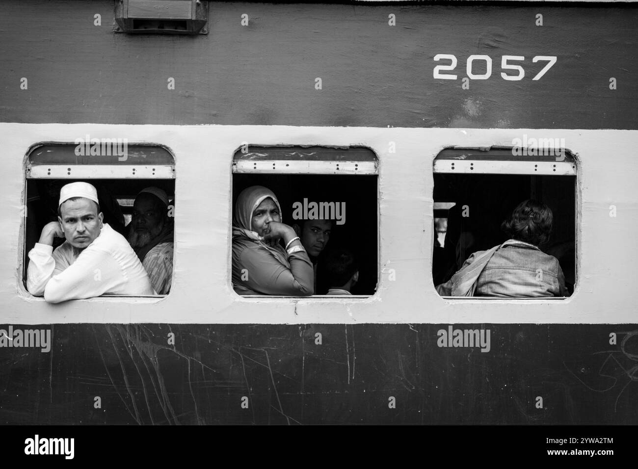 Passengers looking out of the window of a train, Monochrom, Dhaka ...