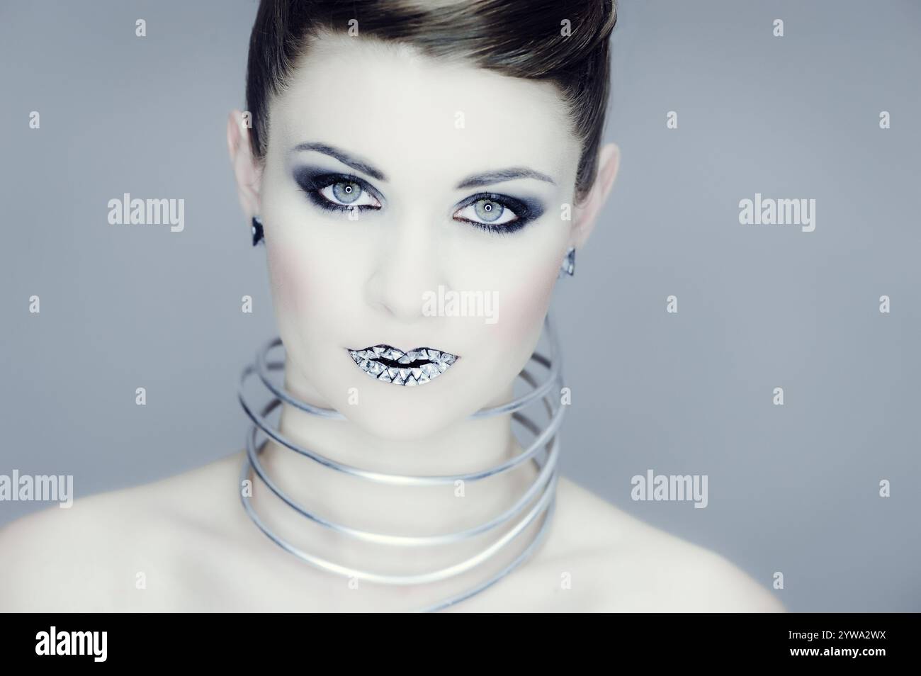 Made-up woman in silver look, woman in silverlook Stock Photo - Alamy