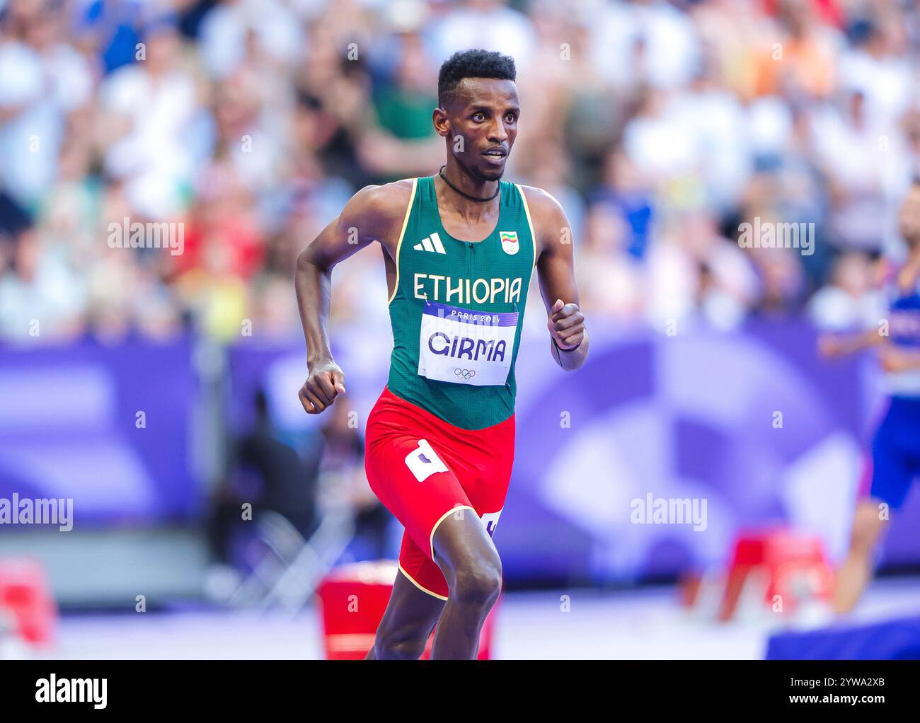 Lamecha Girma participating in the 3000 metres steeplechase at the ...