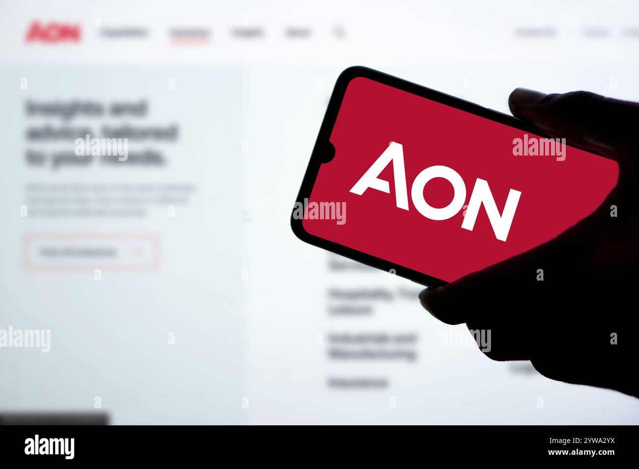 Smartphone displaying logo of Aon PLC, a British multinational professional services firm that ...