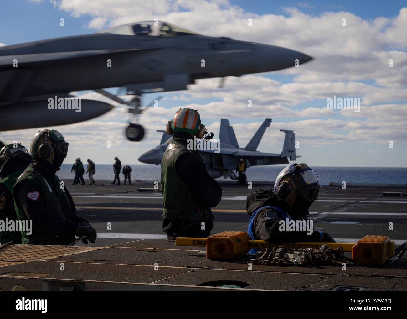 Sailors assigned to the world's largest aircraft carrier, USS Gerald R. Ford (CVN 78), observe ...