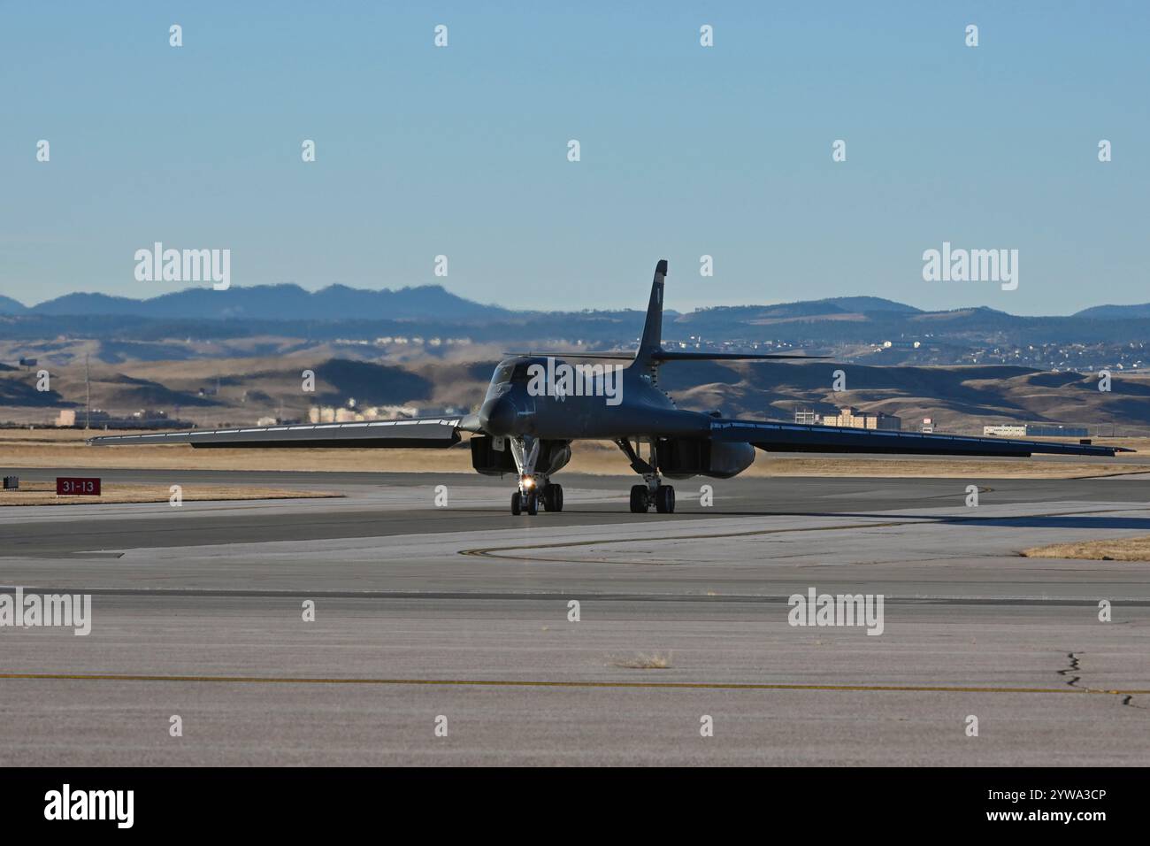 A U.S. Air Force B-1B Lancer assigned to the 37th Bomb Squadron taxis ...