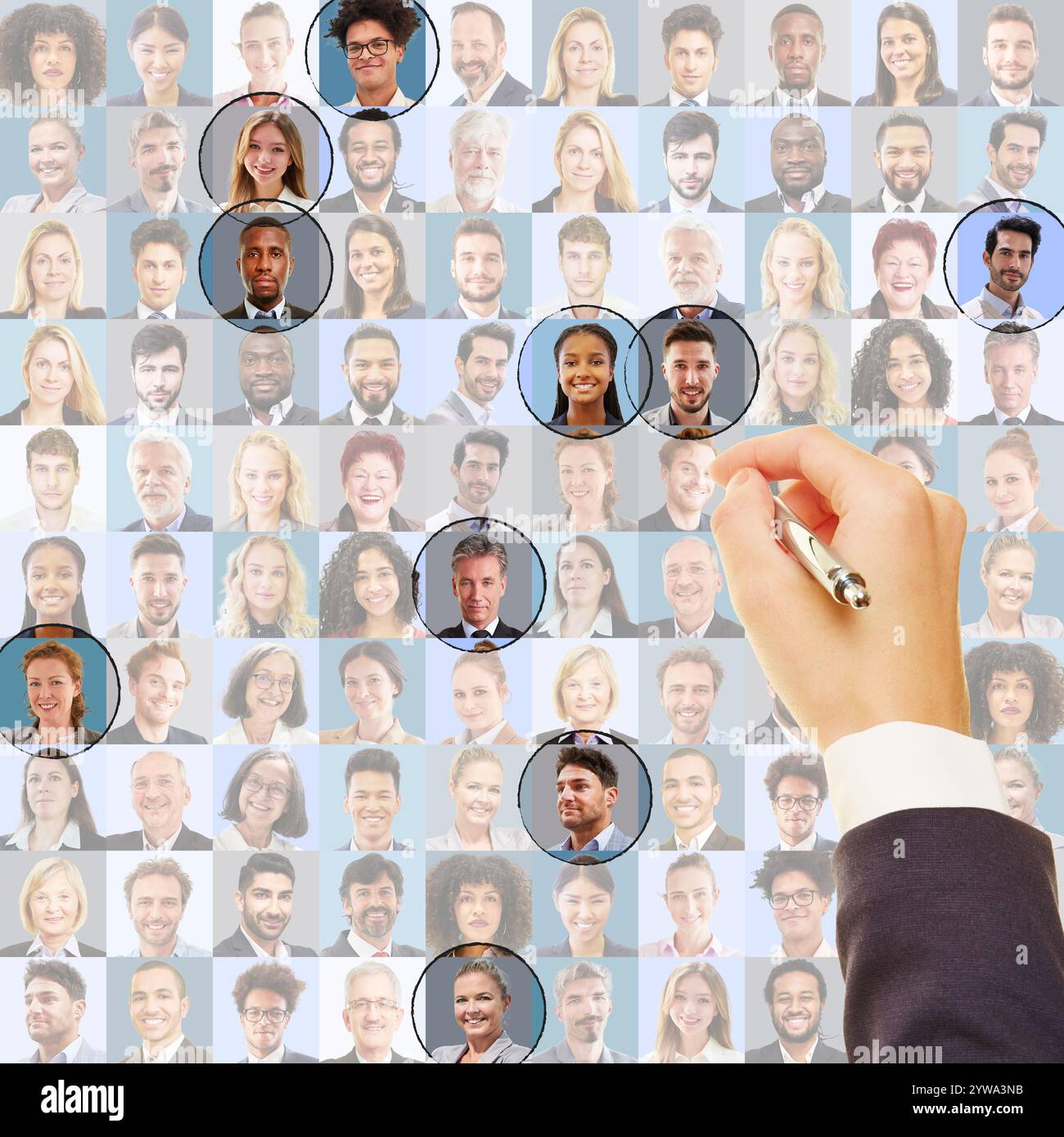 Hand with ballpoint pen marks business portraits of business people as ...