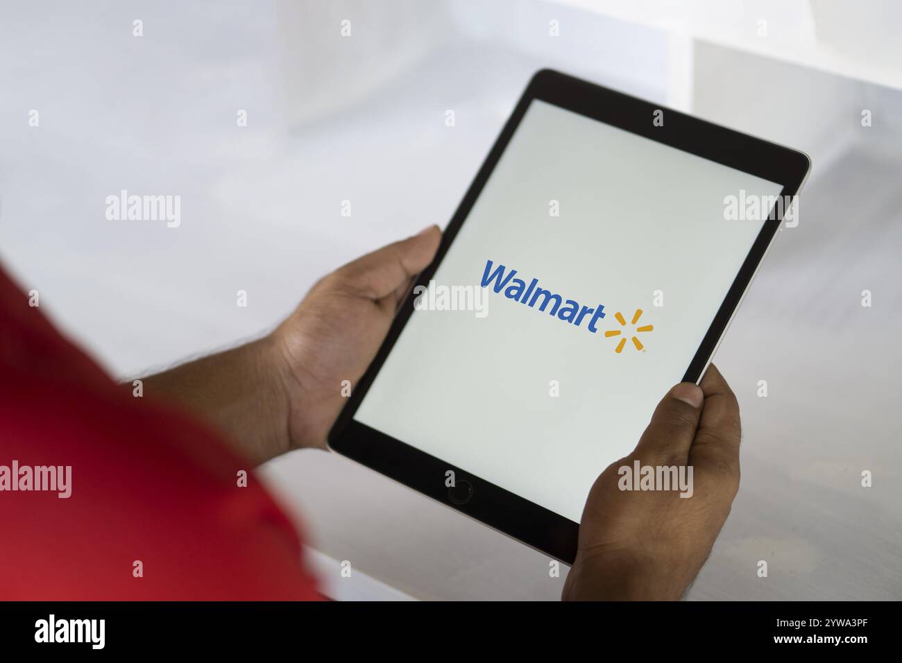 Walmart Plus logo displayed on smartphone screen with Walmart logo in ...