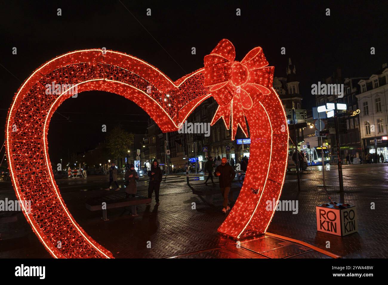 Large red heart of lights illuminates street scene at night, Amsterdam ...