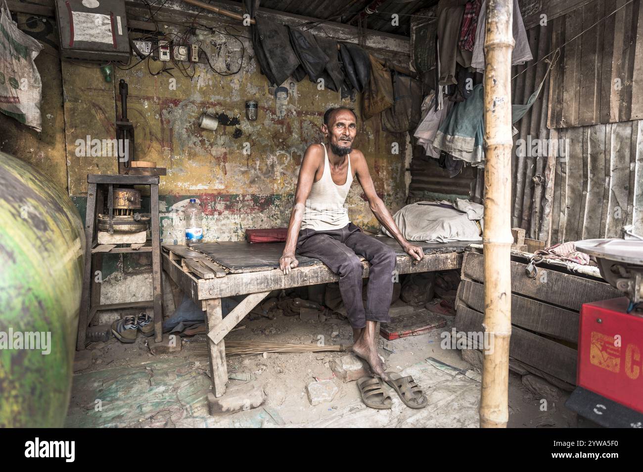 Man on a Britsche of a workshop, Dhaka, Bangladesh, Asia Stock Photo - Alamy