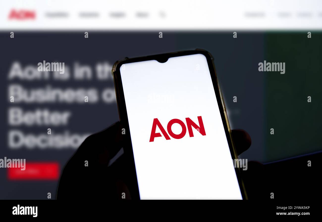 Smartphone displaying logo of Aon PLC, a British multinational professional services firm that ...