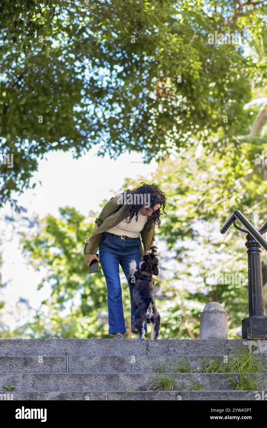 Dog greets woman hi-res stock photography and images - Alamy