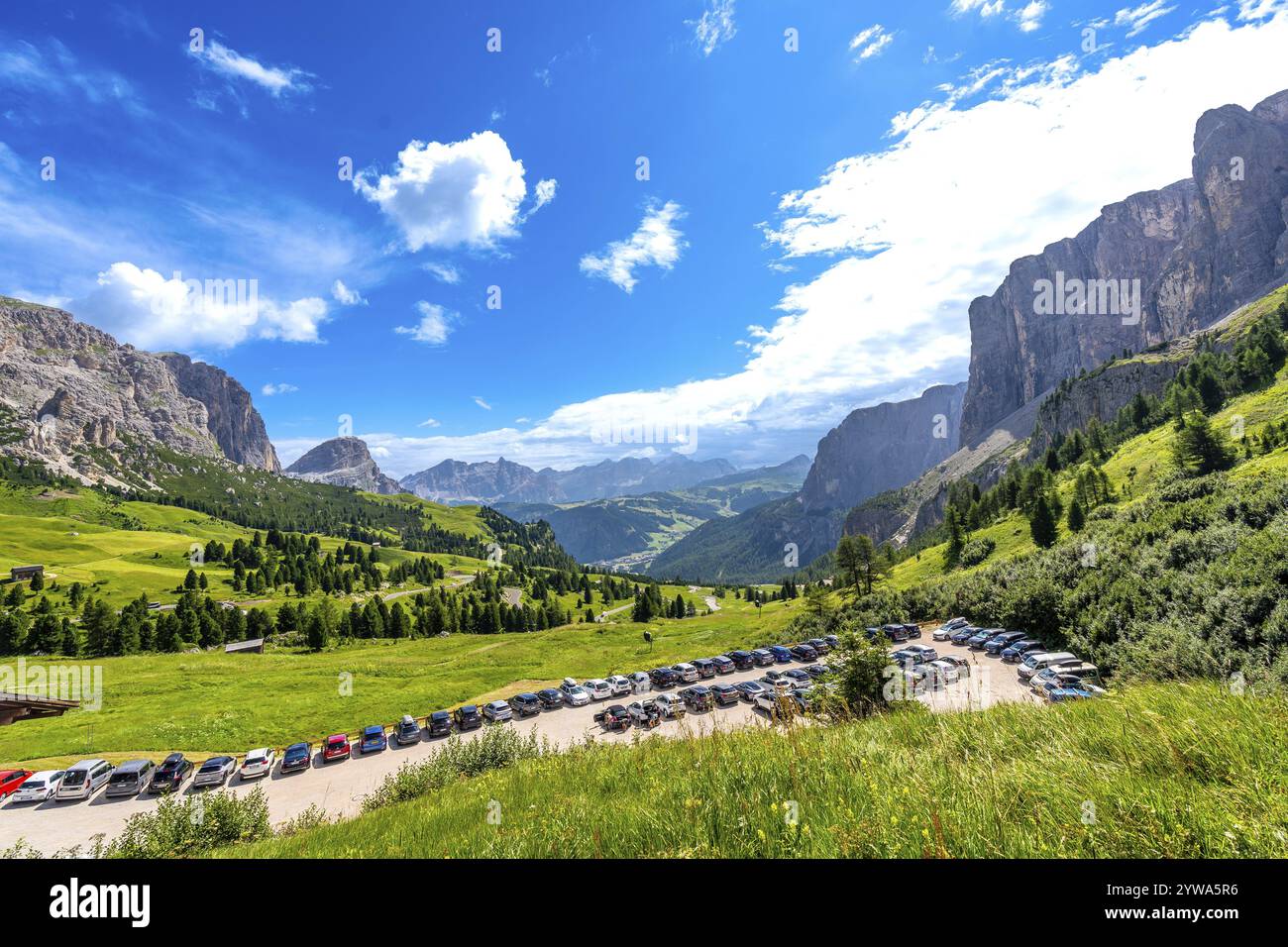 Cars parked near gardena pass with breathtaking views of the dolomites ...