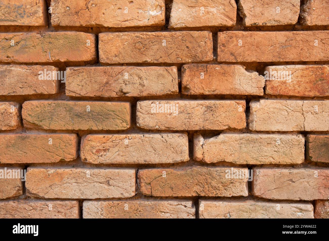 Old orange clay bricks wall background. Bricks backdrop Stock Photo - Alamy