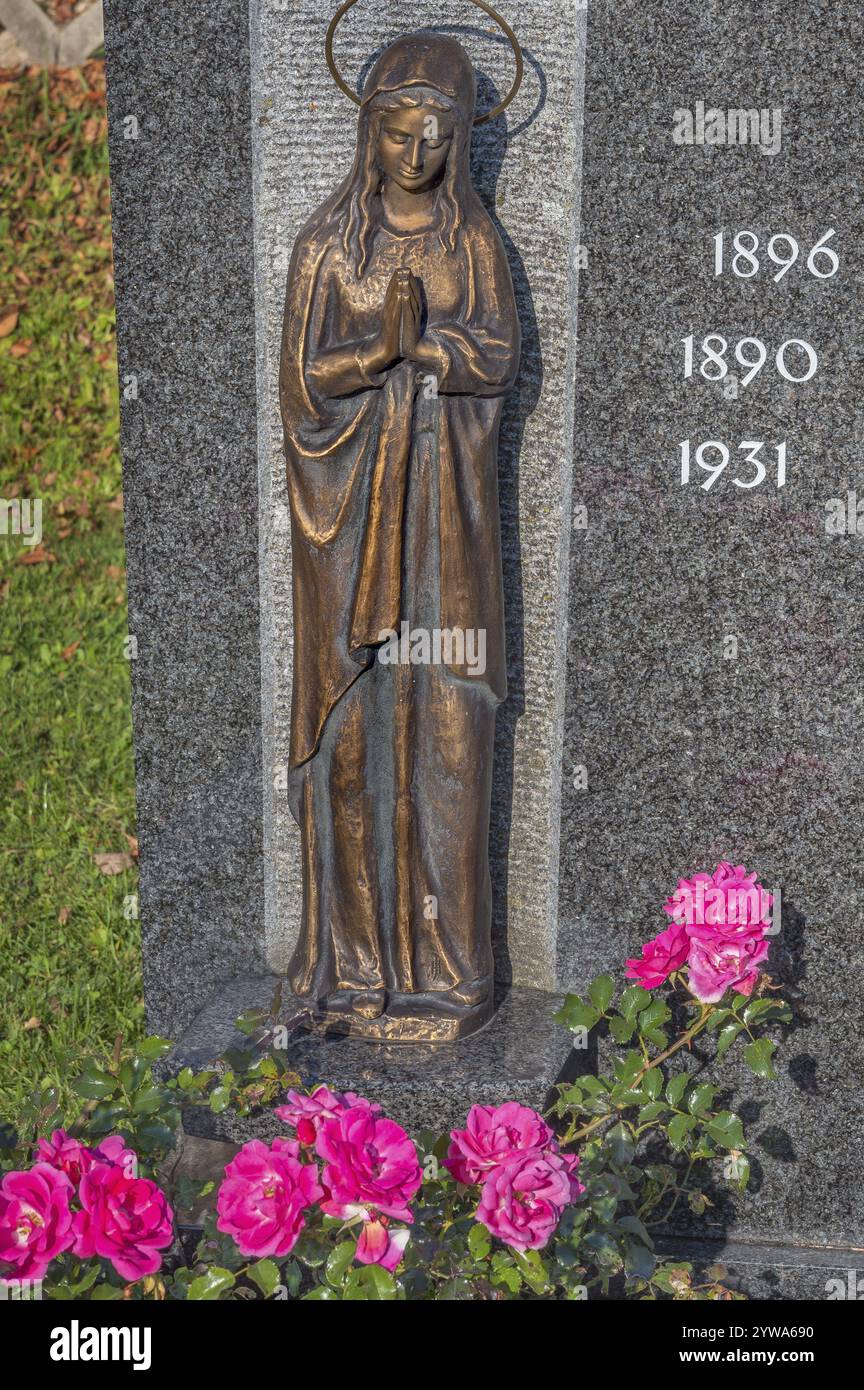 Gravestone with statue of the Virgin Mary and roses at the rococo ...