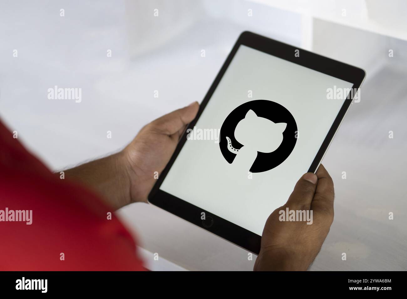 Github logo is displayed on smartphone Stock Photo - Alamy