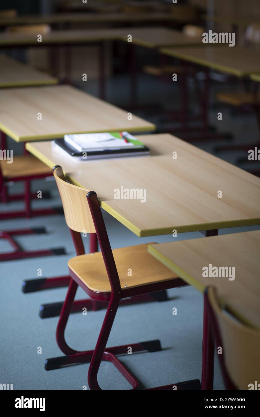 School furniture and textbook on a bright day in an unoccupied ...