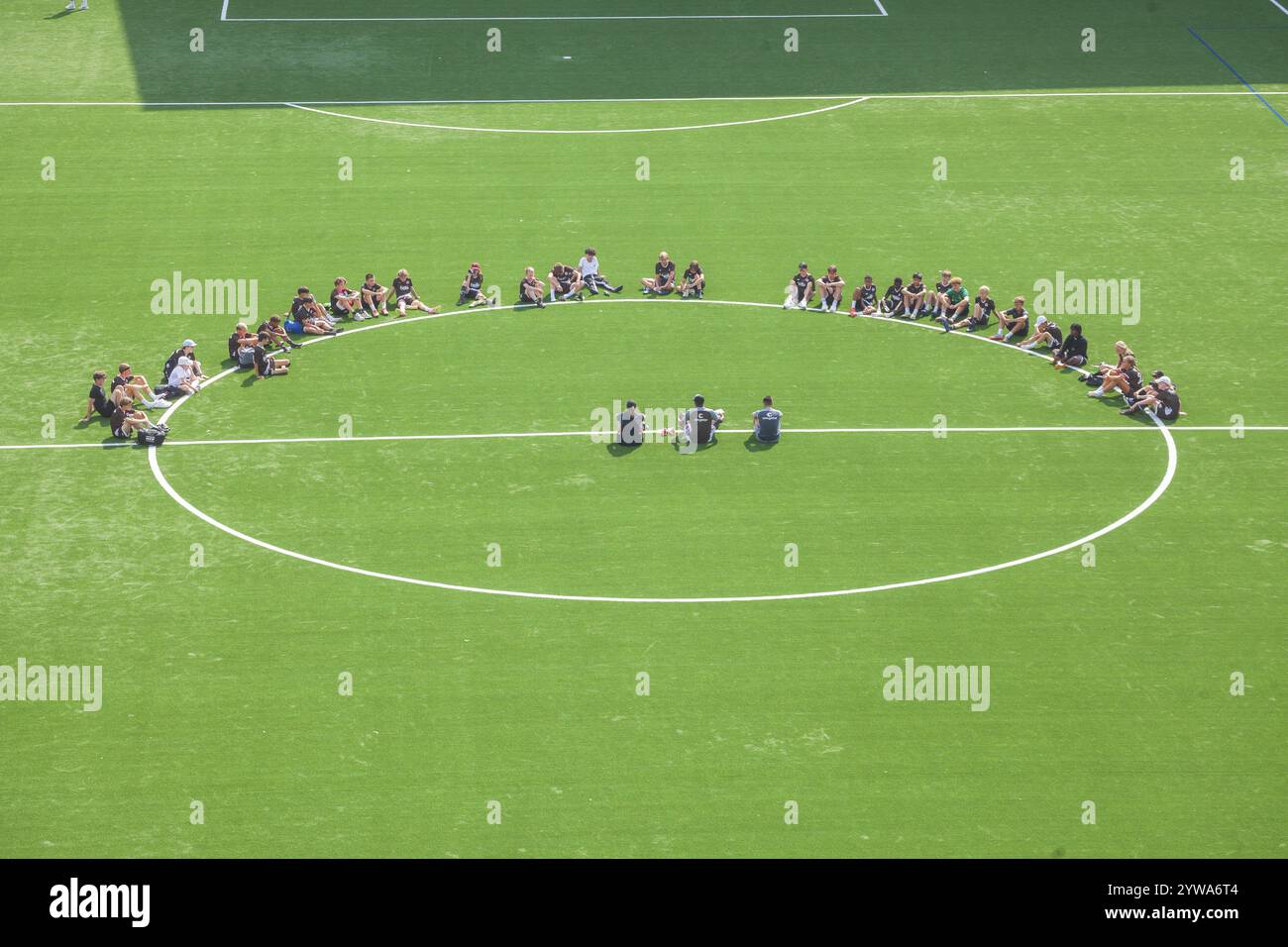 Football player at the centre circle, football pitch at Millerntor ...