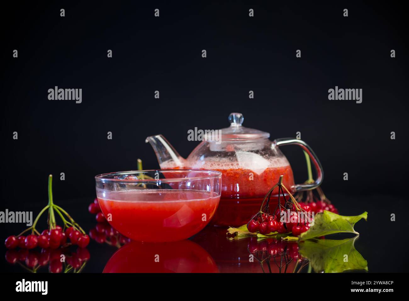 nutritious vitamin tea from viburnum berries, isolated on black ...