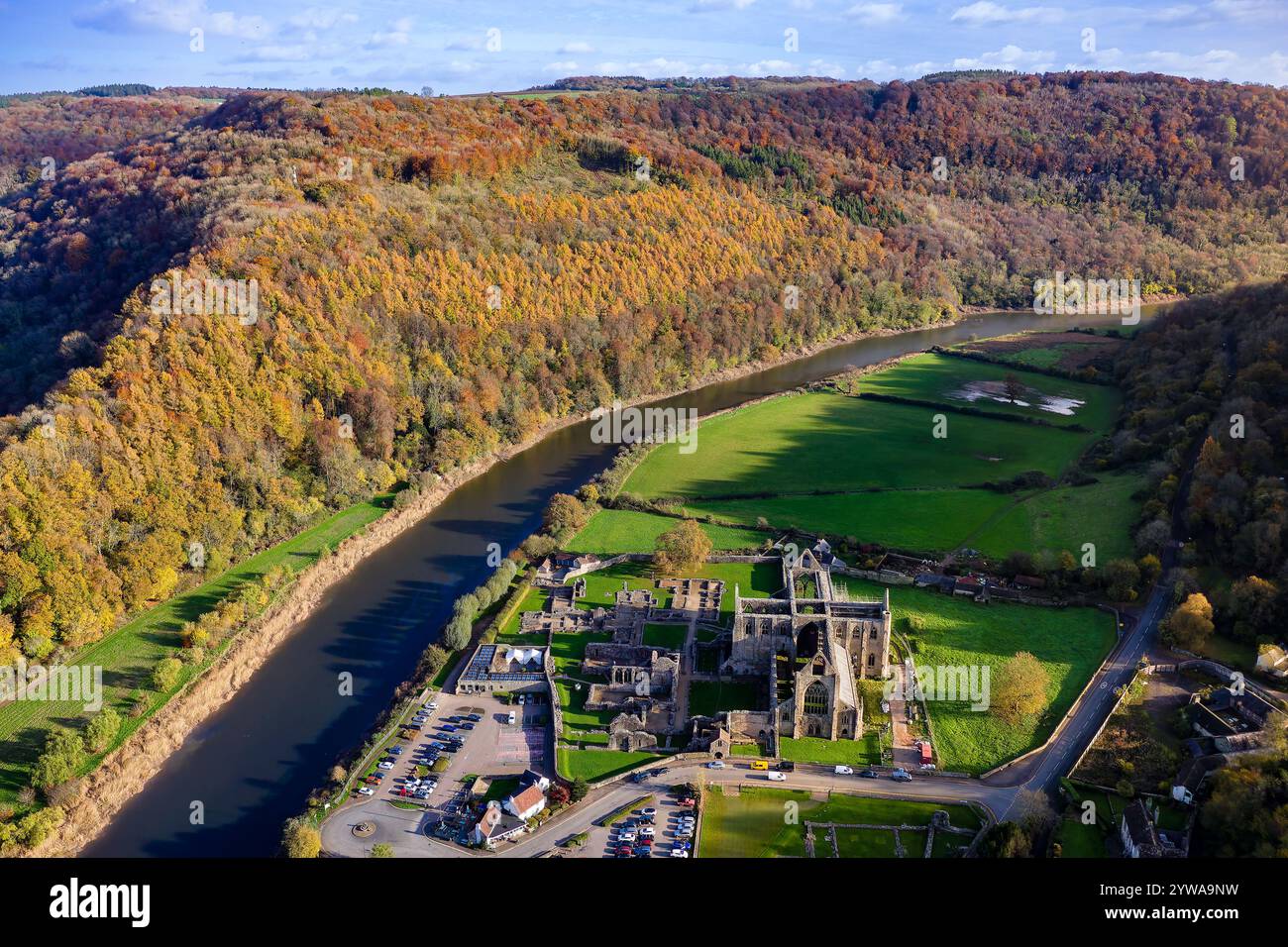Aerial view of the River Wye, autumn trees and the ruins of an ancient ...