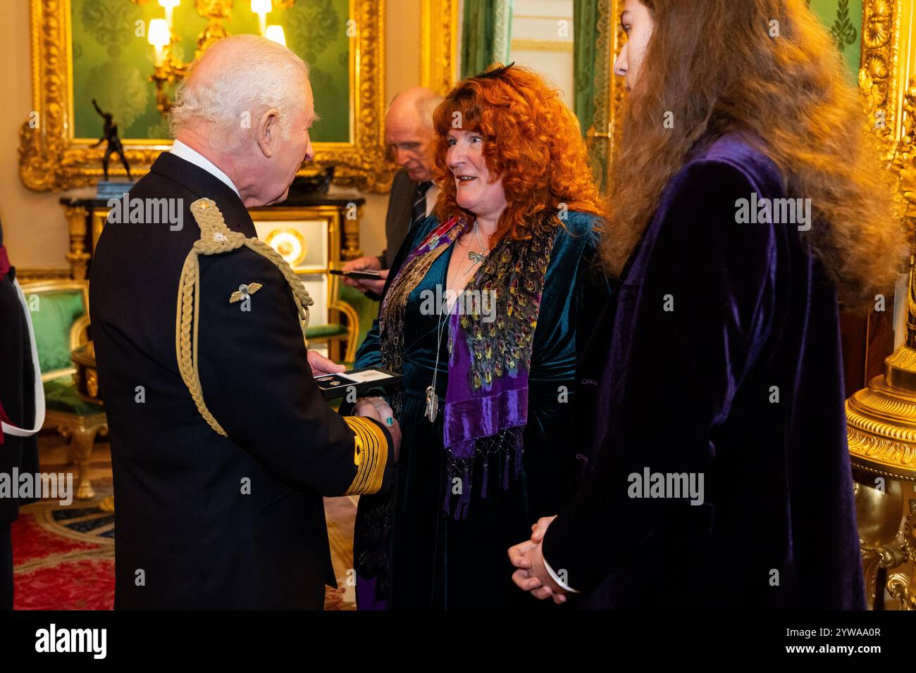 King Charles III presents an Elizabeth Emblem to Rebecca Lombard-Earl ...