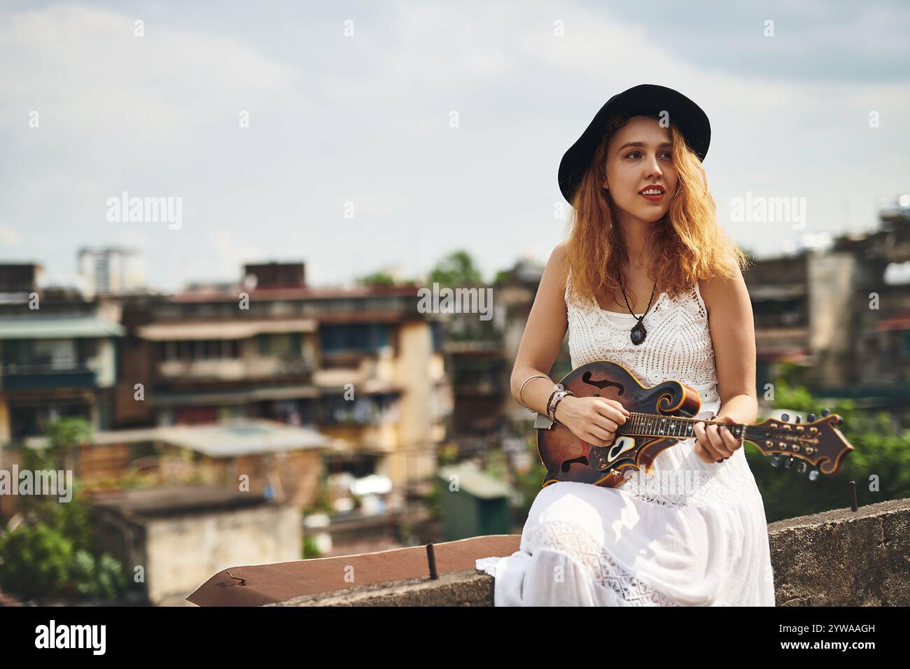 Playing, music and woman with guitar in city for practice, song and ...