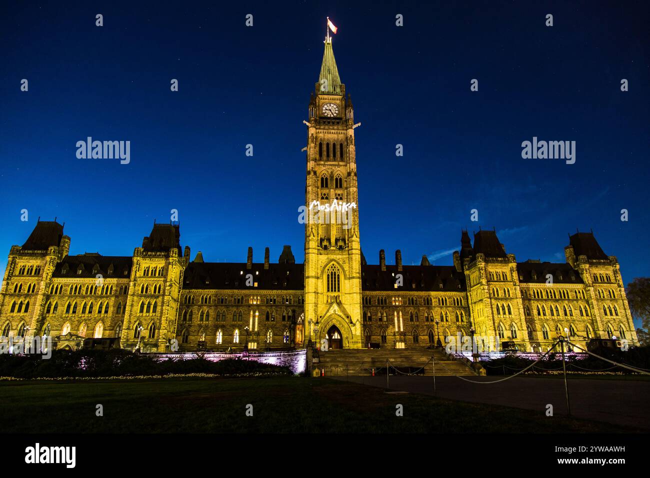The building is lit up at night, giving it a majestic and grand ...