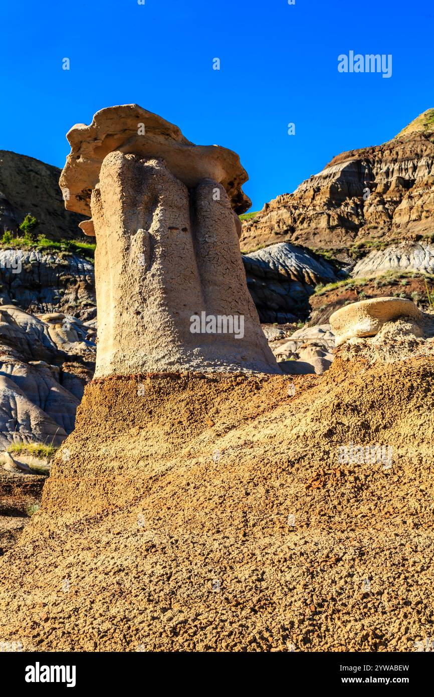 A large rock formation with a small hole in the middle. The rock is ...