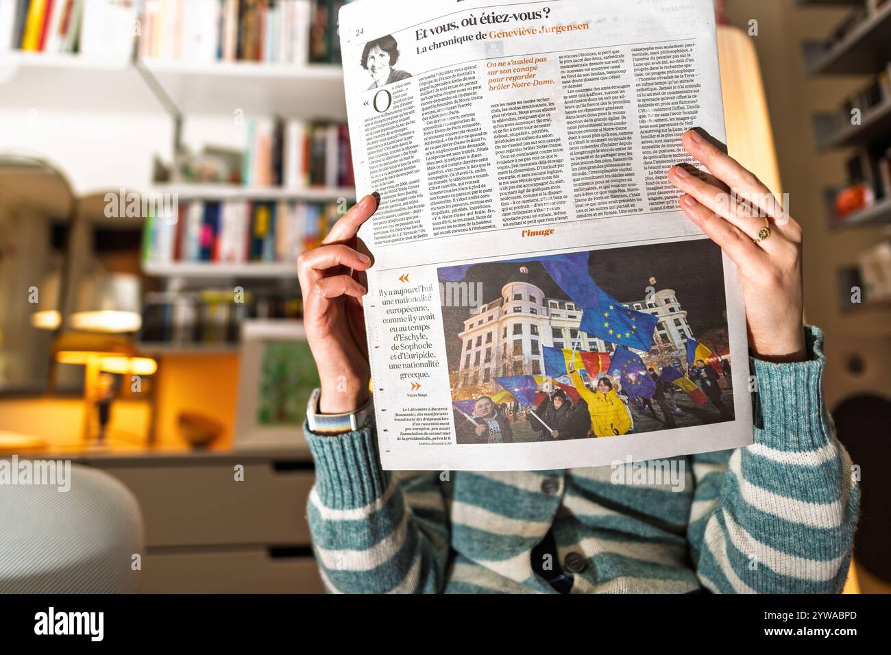 Paris, France - Dec 9, 2024: Person holding La Croix newspaper ...