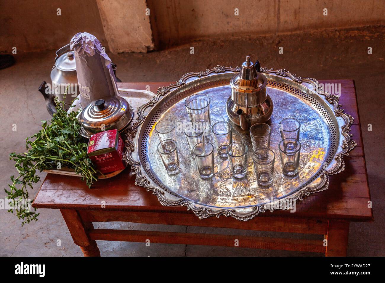 On a low table, all the equipment for preparing mint tea, Morocco's emblematic drink, is ...