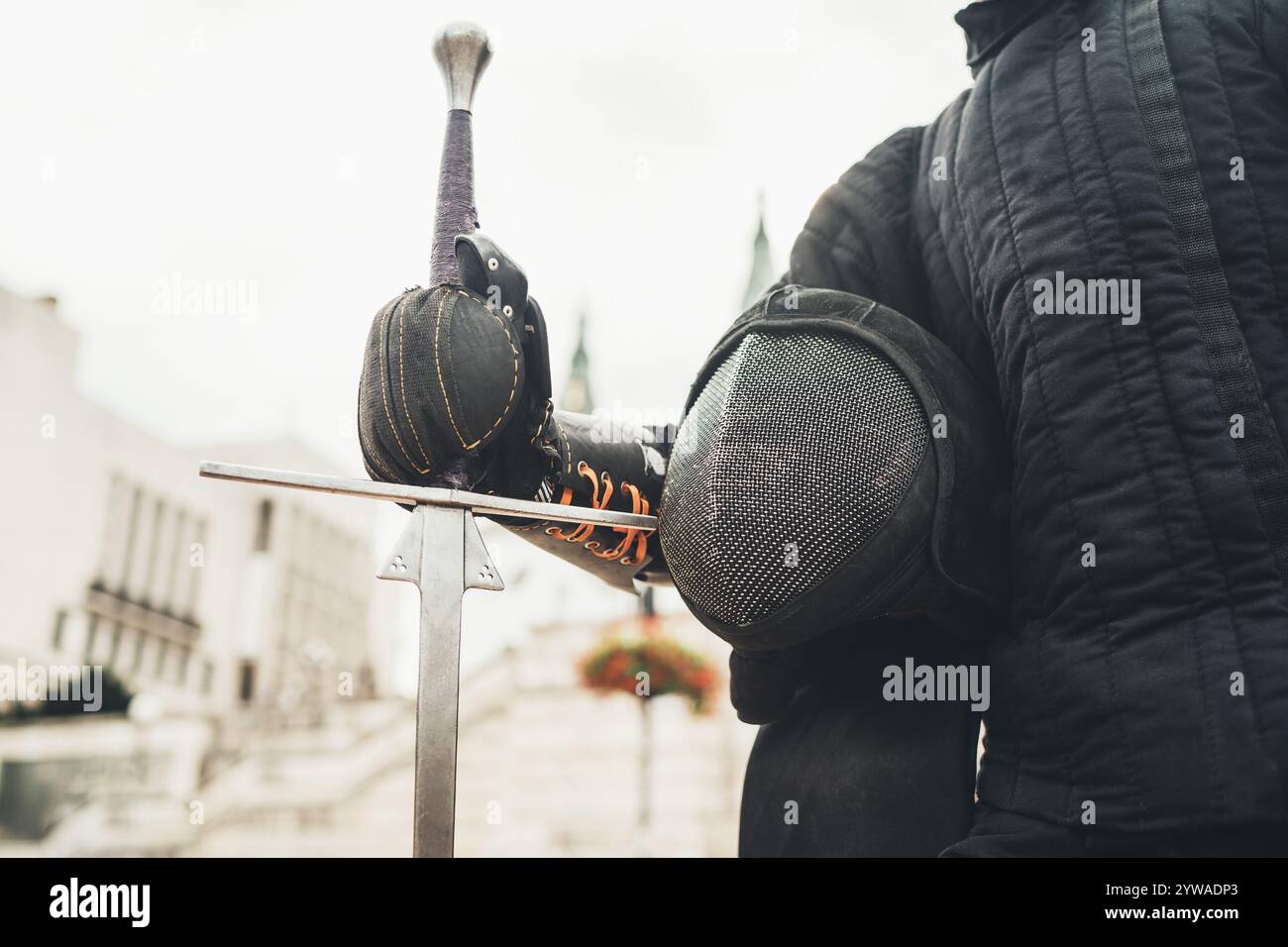 Long medieval sharp sword and protective mask close-up and warrior ...