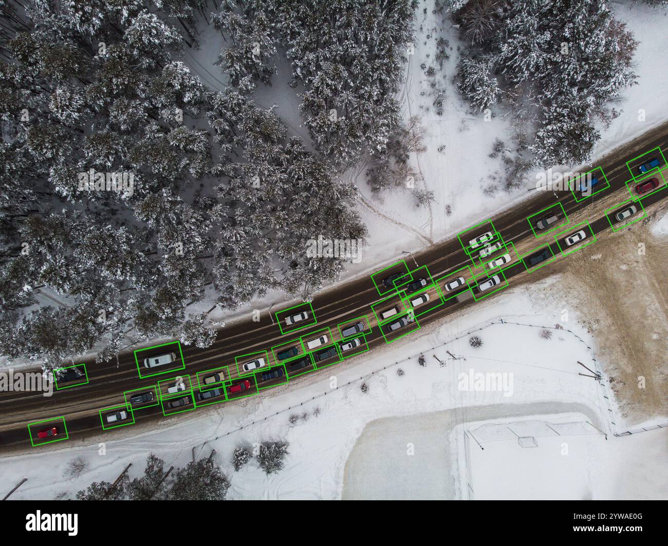 Aerial view of moving traffic on a winter highway with a traffic ...