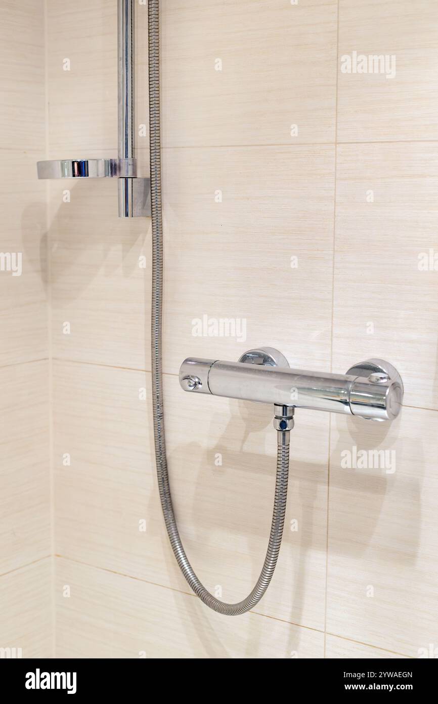 Modern Chrome Shower Fixture on Tiled Wall Stock Photo - Alamy
