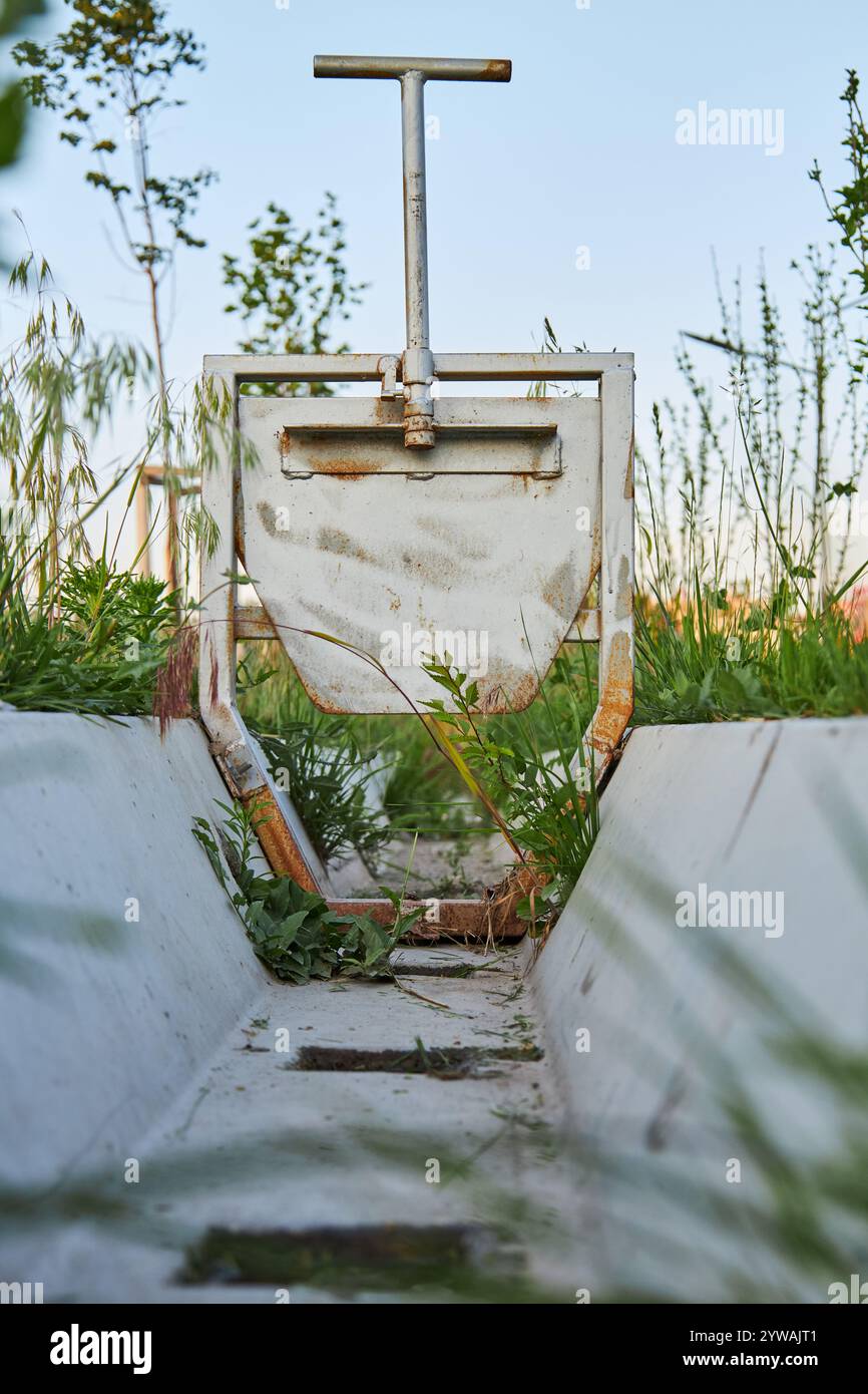 Metal valve for shutting off water supply. Drained Irrigation ditch ...