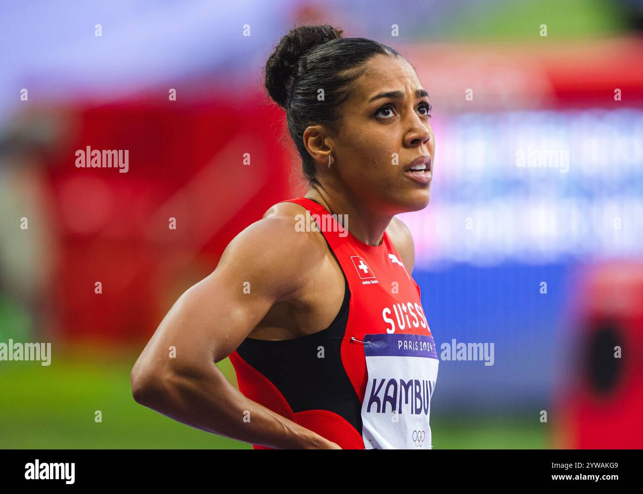 Mujinga Kambundji participating in the 100 meters at the Paris 2024 ...