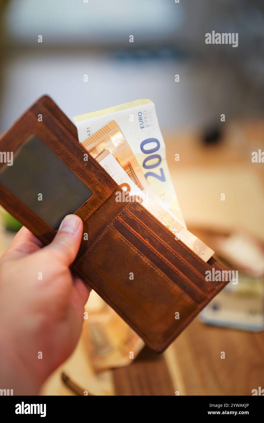 hand holding wallet cash money banknotes blurred background living room ...
