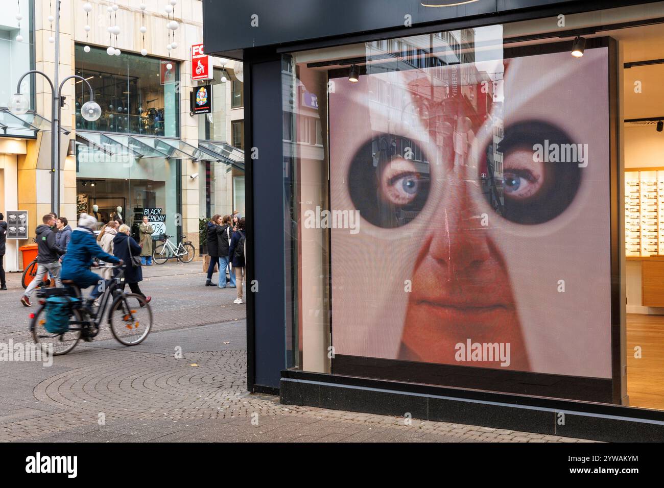 advertising display in the window of an optician in the shopping street ...