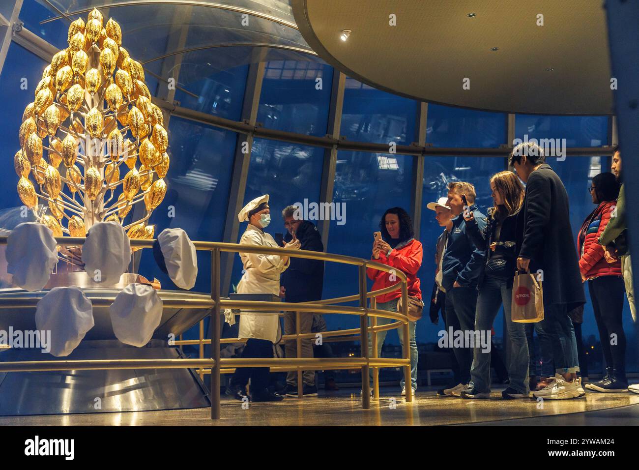 view into the chocolate museum with the chocolate fountain, visitors get a waffle with fresh ...
