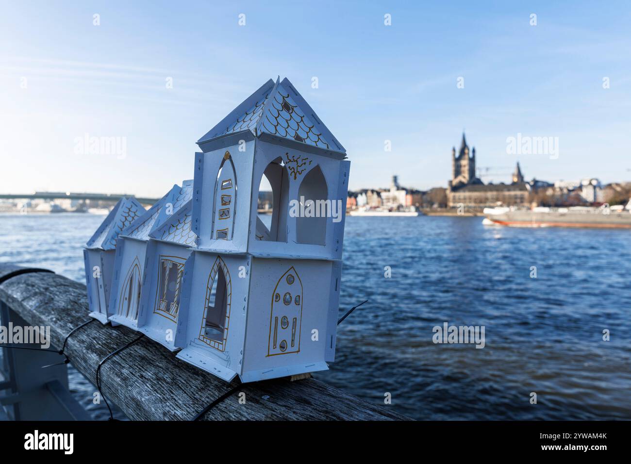 cardboard houses made by children stand on the railings on the banks of ...
