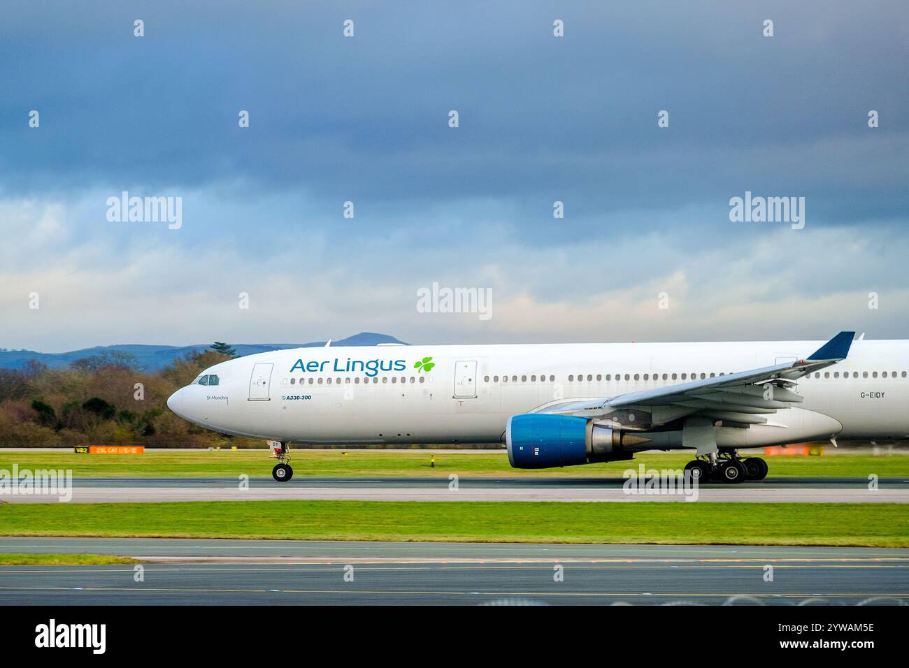 An Aer Lingus plane on runway at Manchester Airport Stock Photo - Alamy