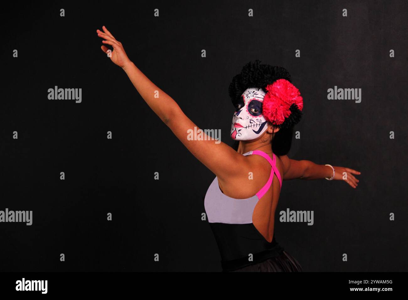 Mexican teenage woman with catrina makeup and does dancer steps to ...