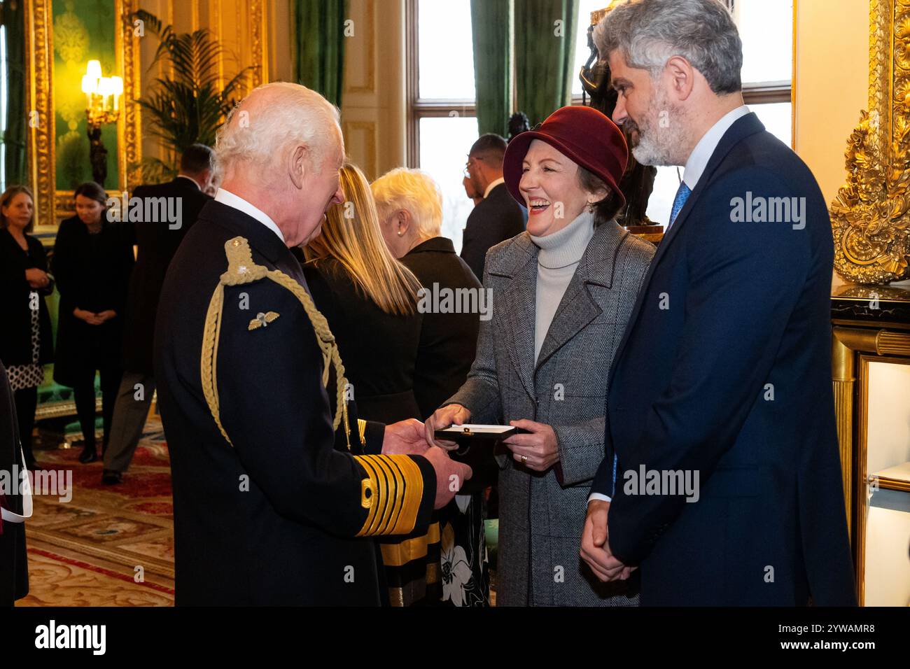 King Charles III presents an Elizabeth Emblem to Jane Houng, for ...