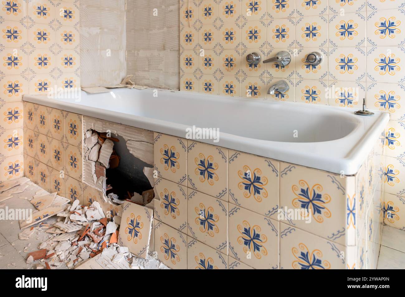 Removing old tiles and bathtub during bathroom renovation Stock Photo ...