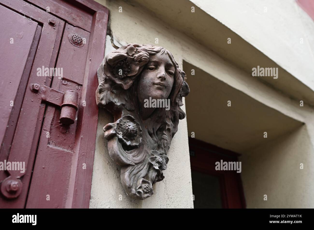 A female statue on the wall of a house in Bacharach Stock Photo - Alamy