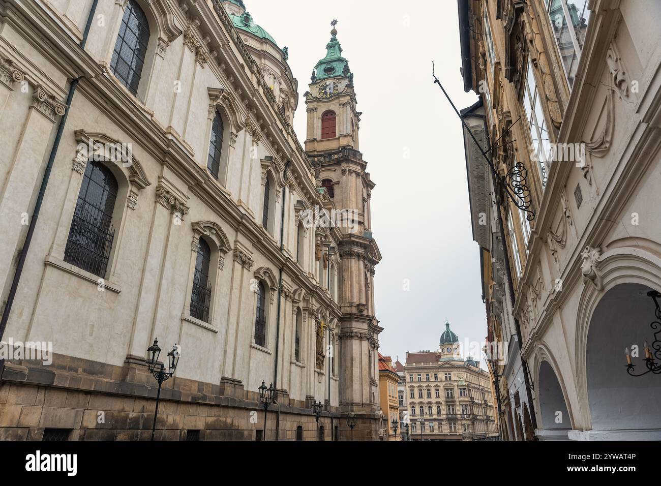 Old buildings with church towers in the streets of the centre of Prague ...