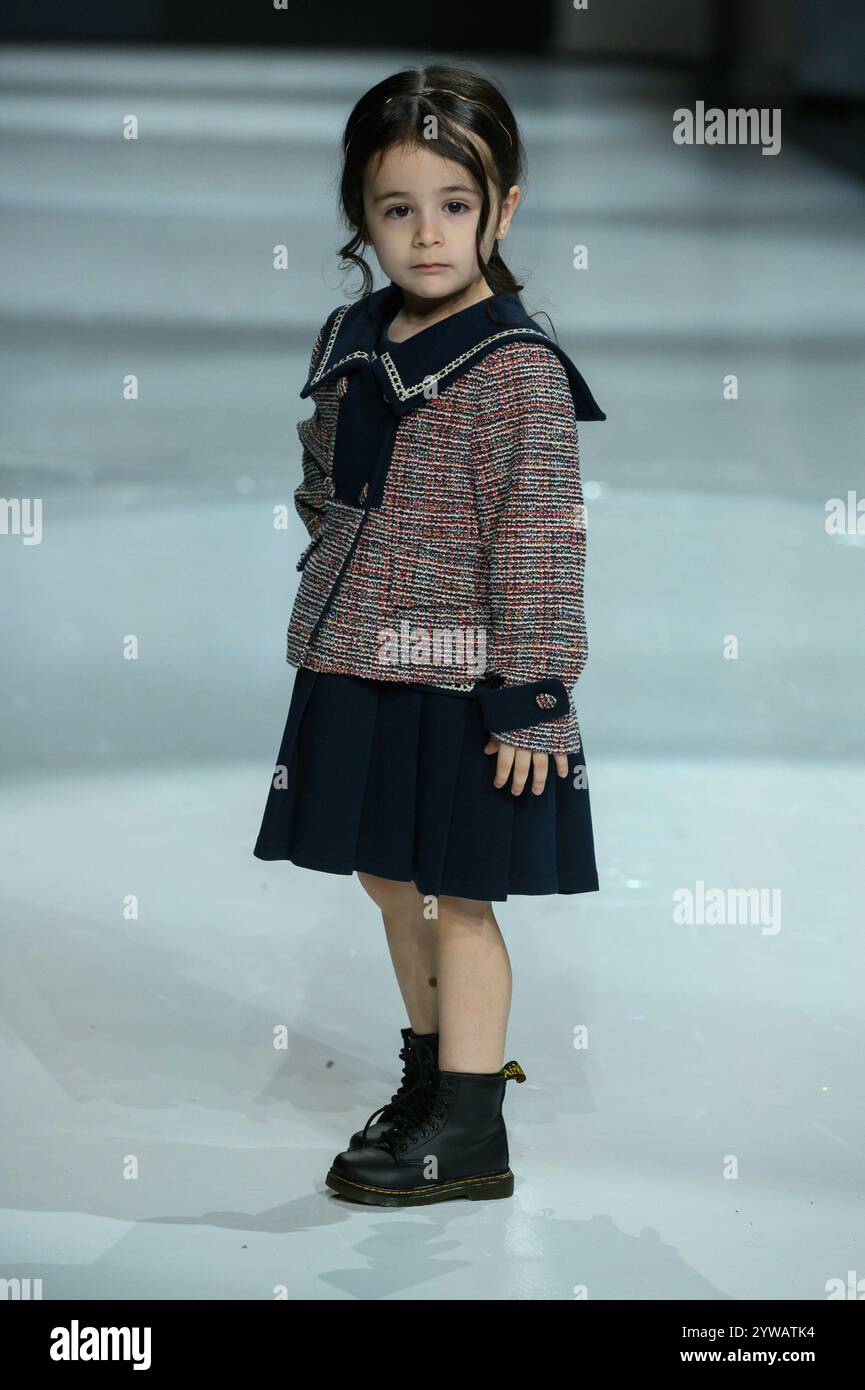 Toronto, ON, Canada - December 7, 2024: A model walks the runway at the ...