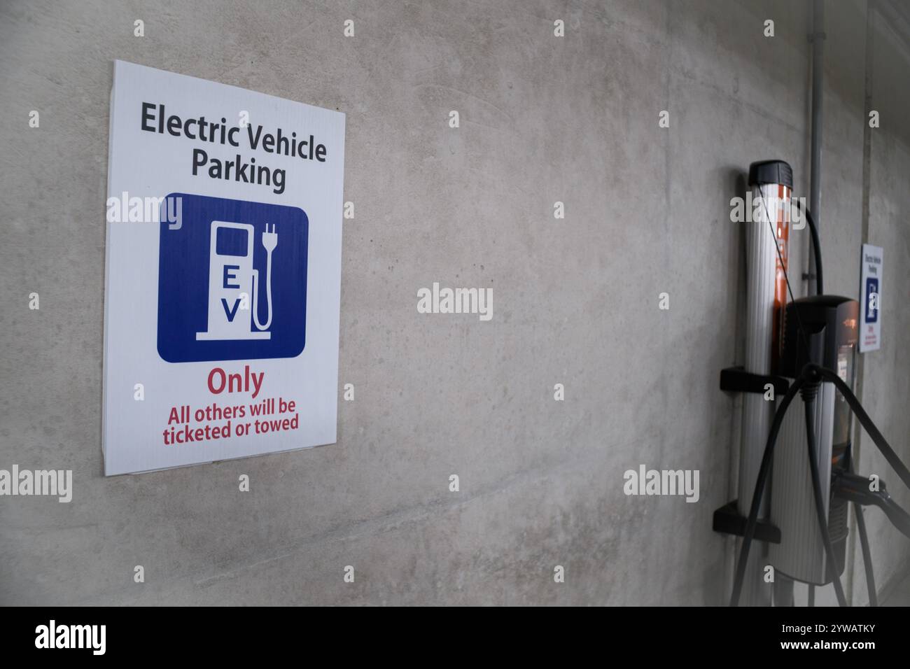 Electric Vehicle Parking Only sign at an EV charging station in Ann ...