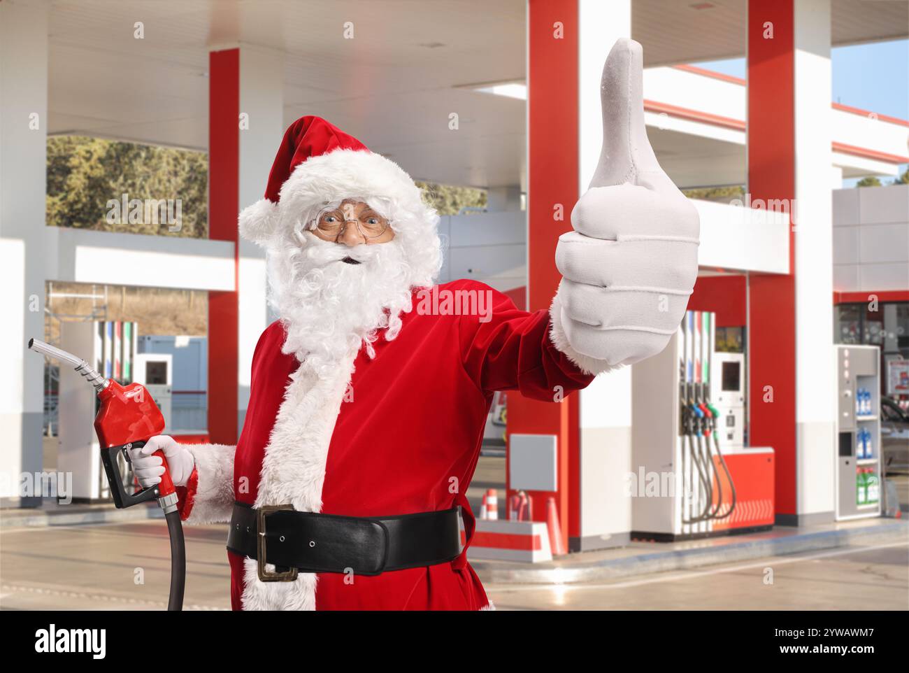 Santa Claus holding a fuel injection gun and gesturing thumbs up at a ...