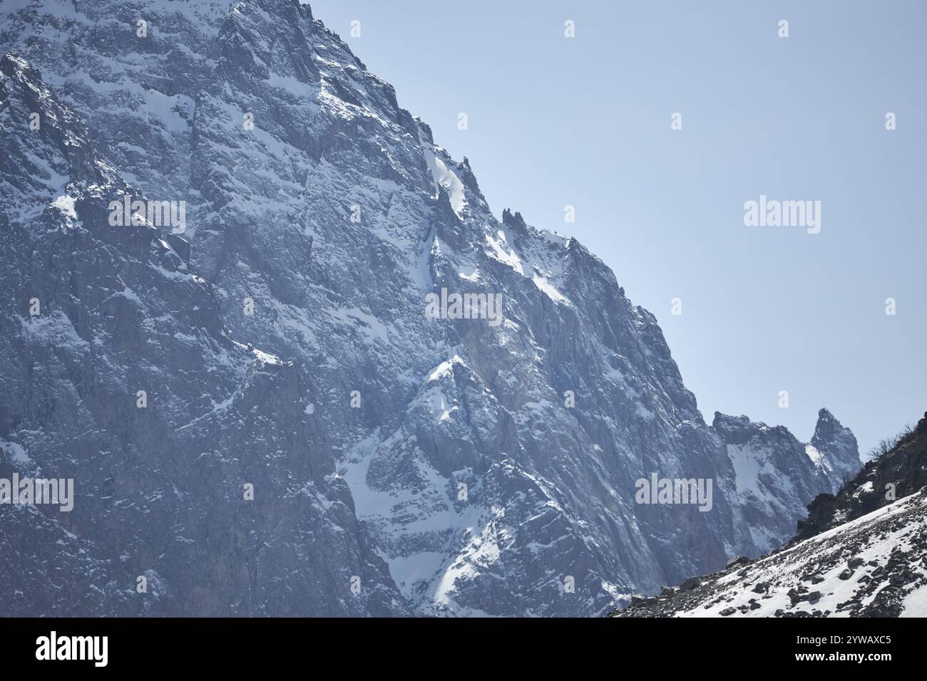 Snowy mountain peaks, rock. Steep sheer slopes. Ala-Archa national park ...