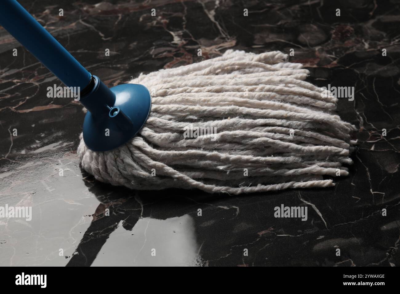 Cleaning black marble floor with string mop, closeup Stock Photo - Alamy